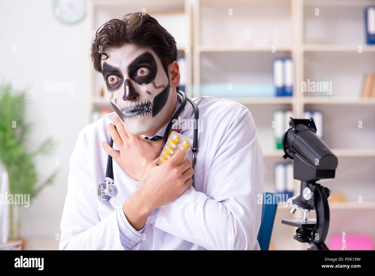 Scary monster doctor working in lab Stock Photo - Alamy