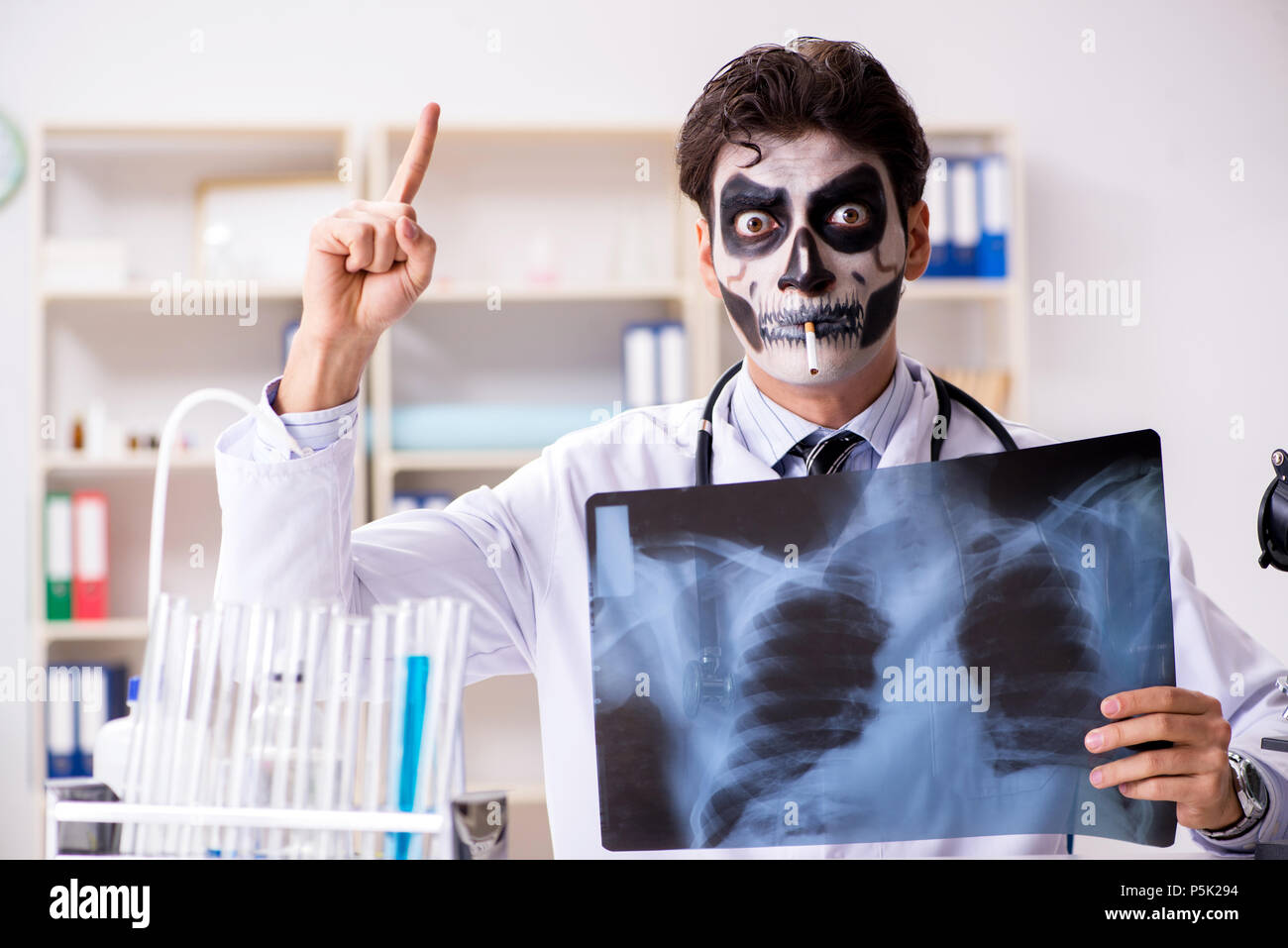 Scary monster doctor working in lab Stock Photo - Alamy