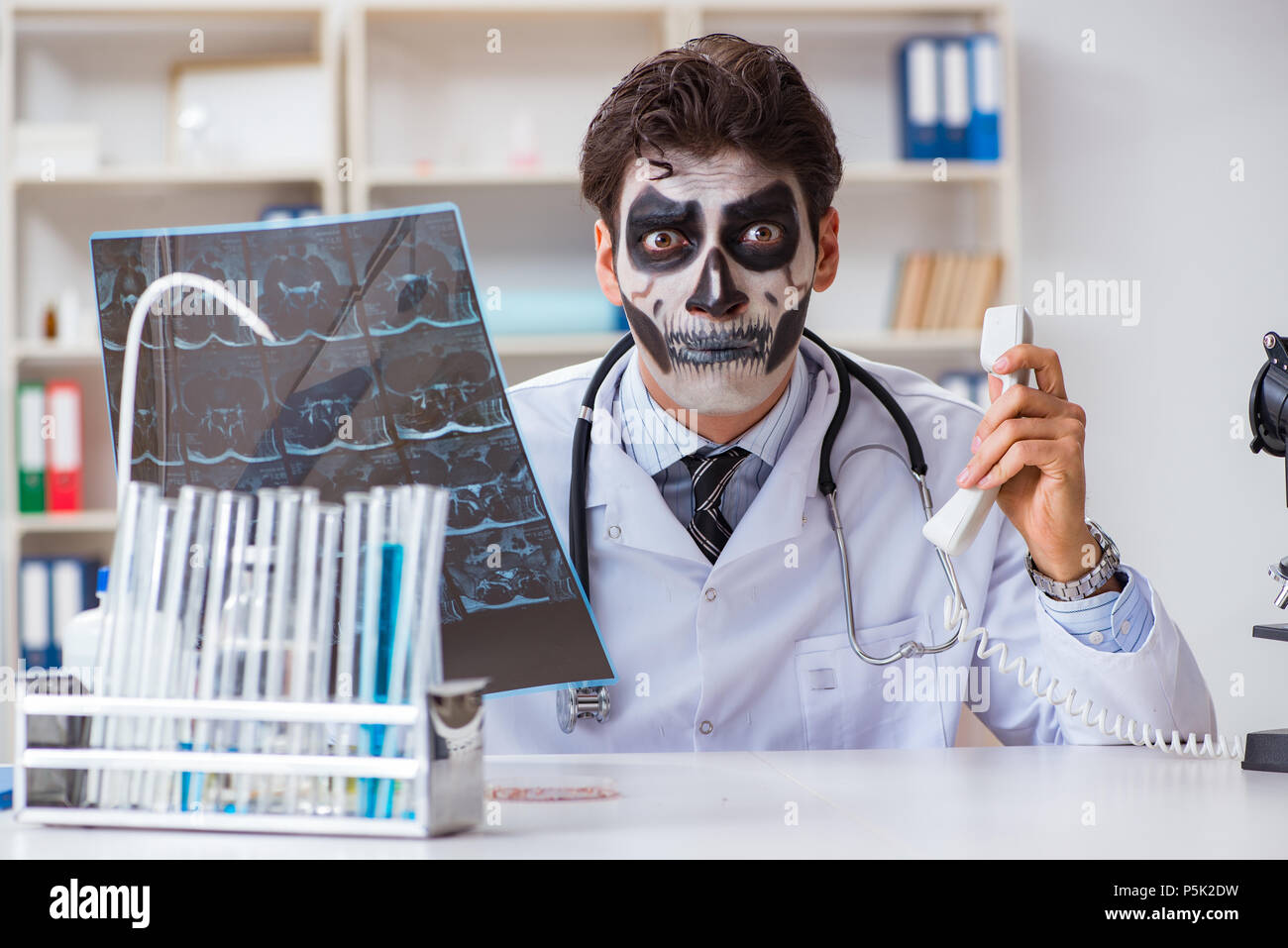 Scary monster doctor working in lab Stock Photo - Alamy