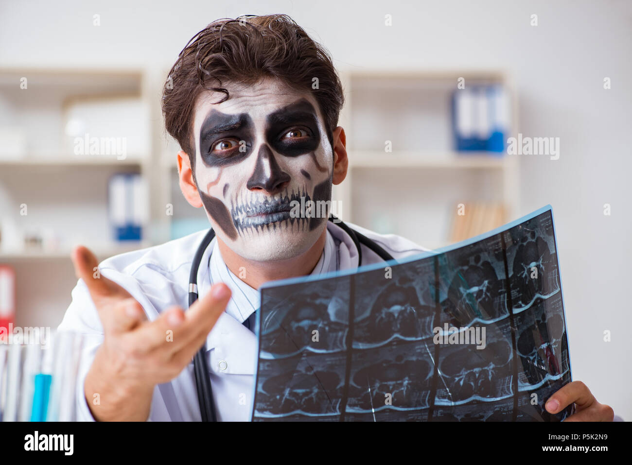 Scary monster doctor working in lab Stock Photo - Alamy