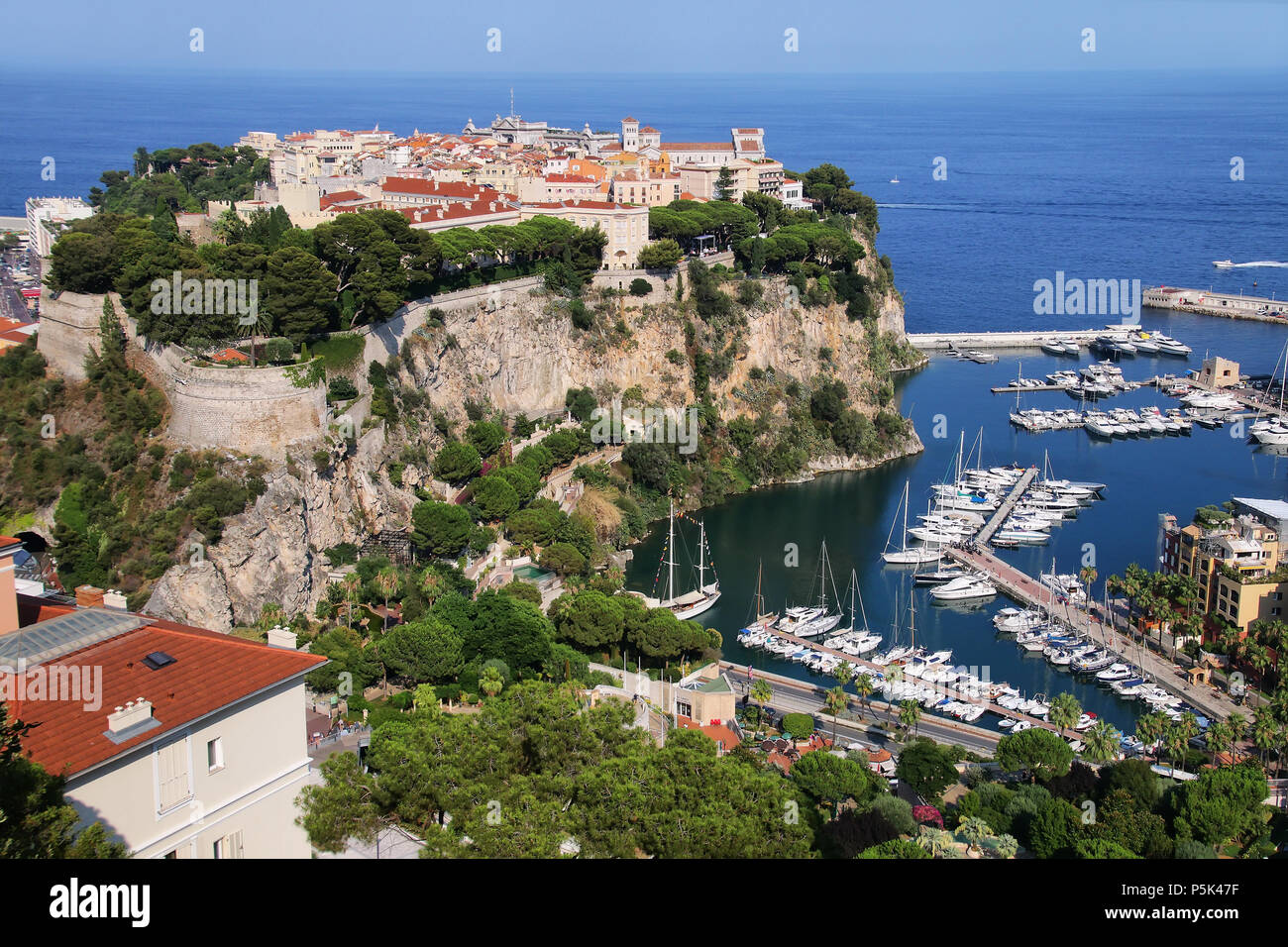 View of Monaco City and boat marina below in Monaco. Monaco City is one ...