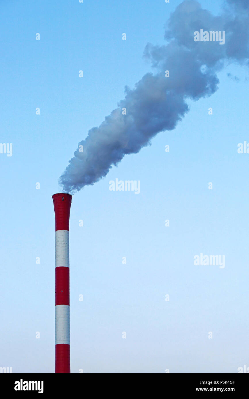 Red and white chimney with smoke Stock Photo - Alamy