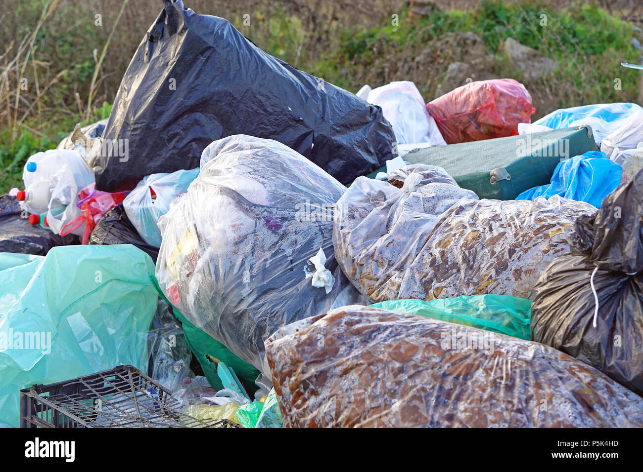 Big pile of garbage trash bags Stock Photo - Alamy