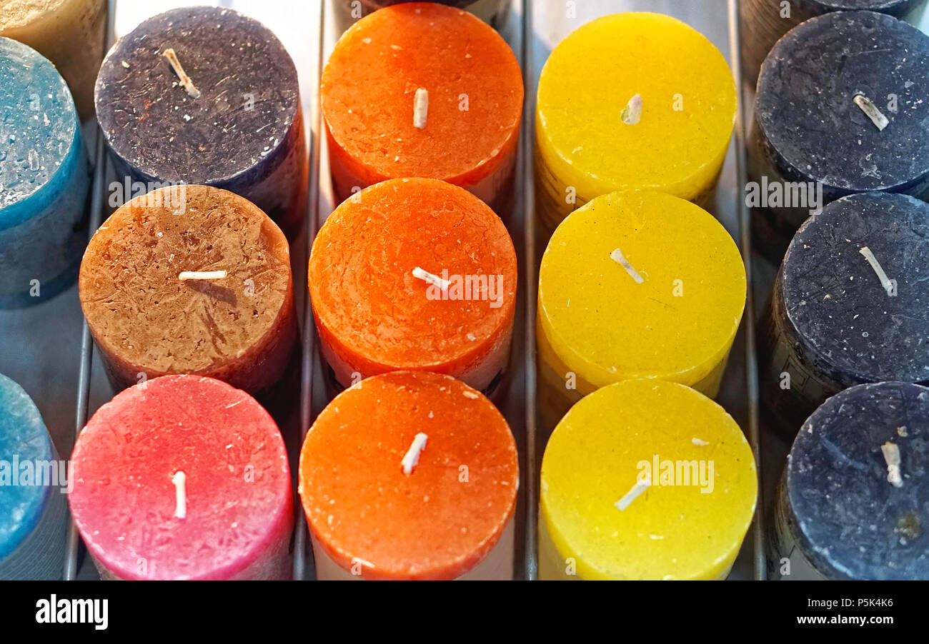 Scented candles in different colours Stock Photo - Alamy