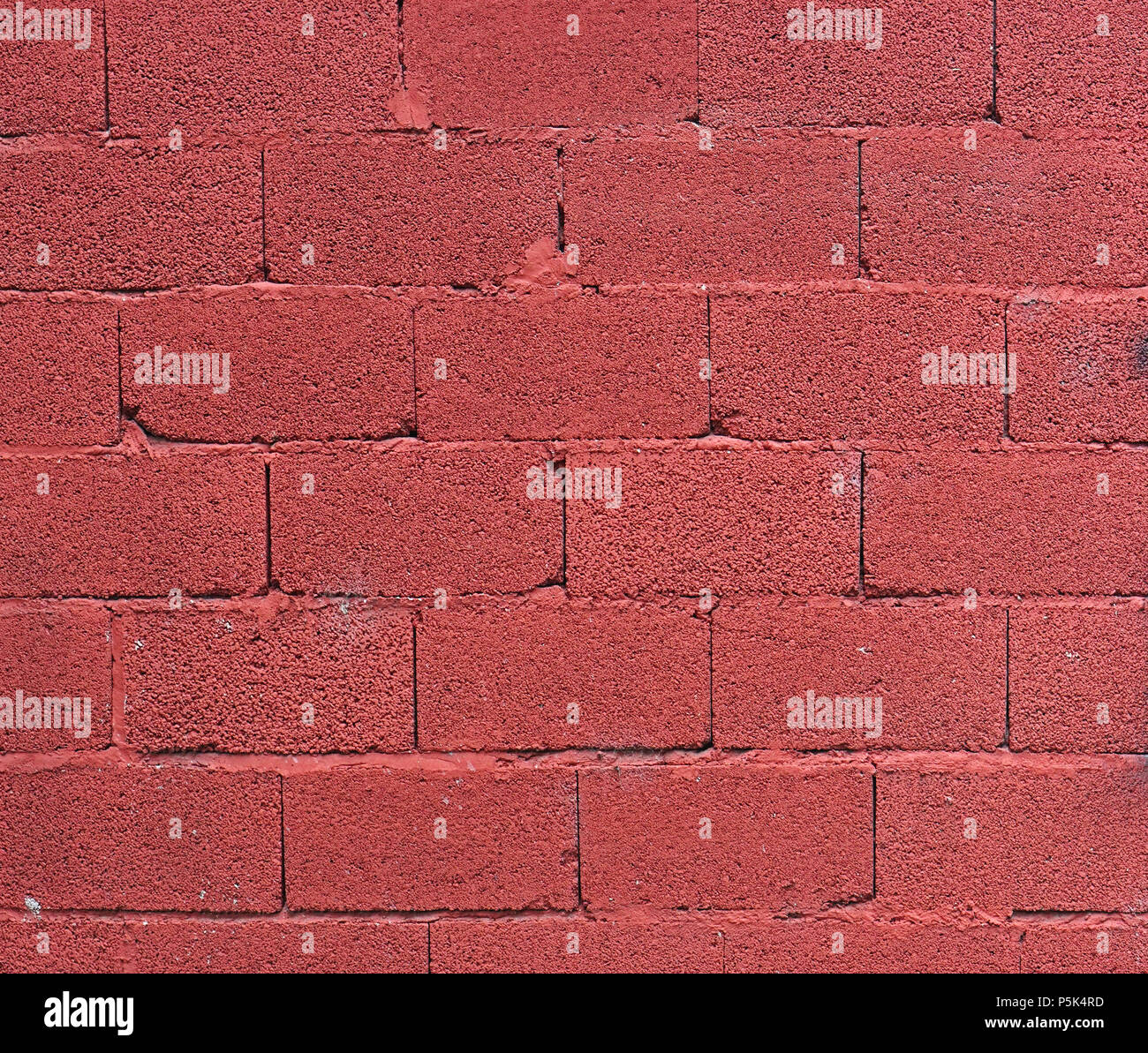 Red wall made from concrete blocks background Stock Photo - Alamy