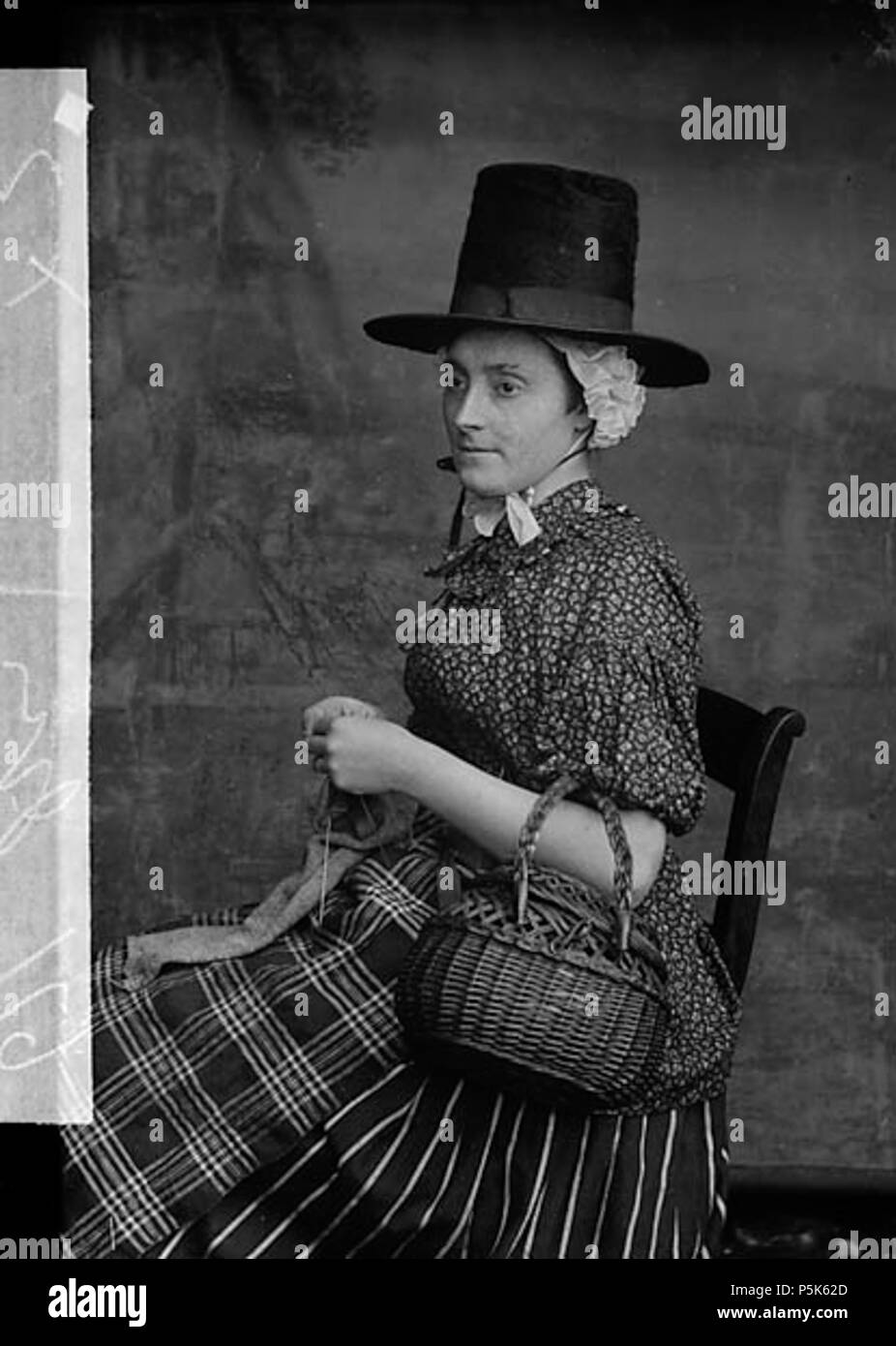 [A woman in national dress and knitting (Jones)] [graphic].. 1 negative ...