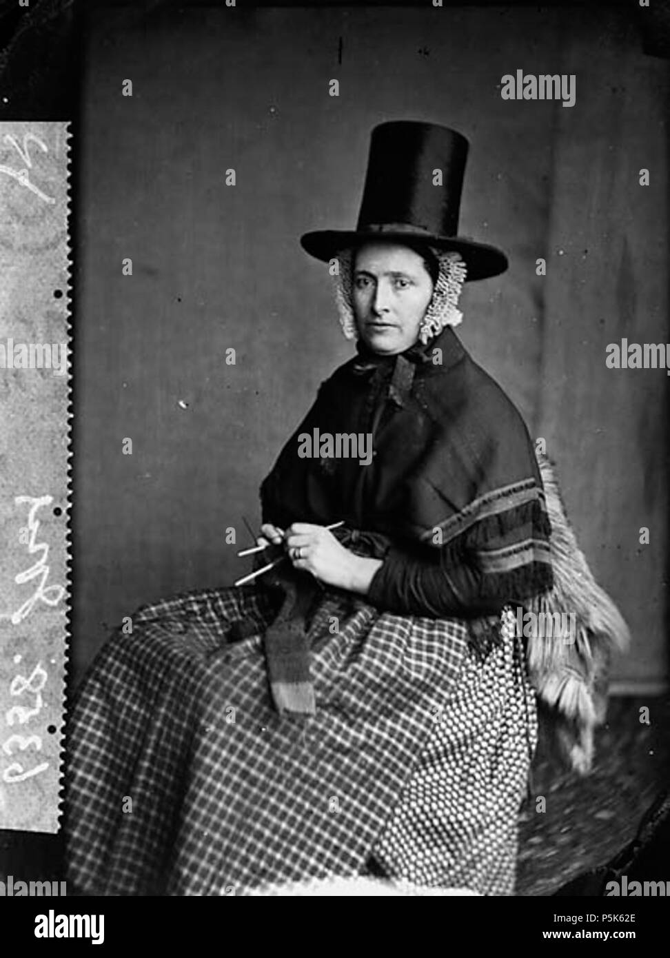 [A woman in national dress and knitting (Jones)] [graphic].. 1 negative ...
