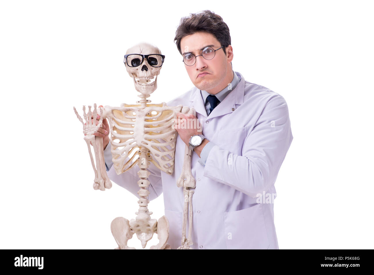Young doctor with skeleton isolated on white Stock Photo - Alamy