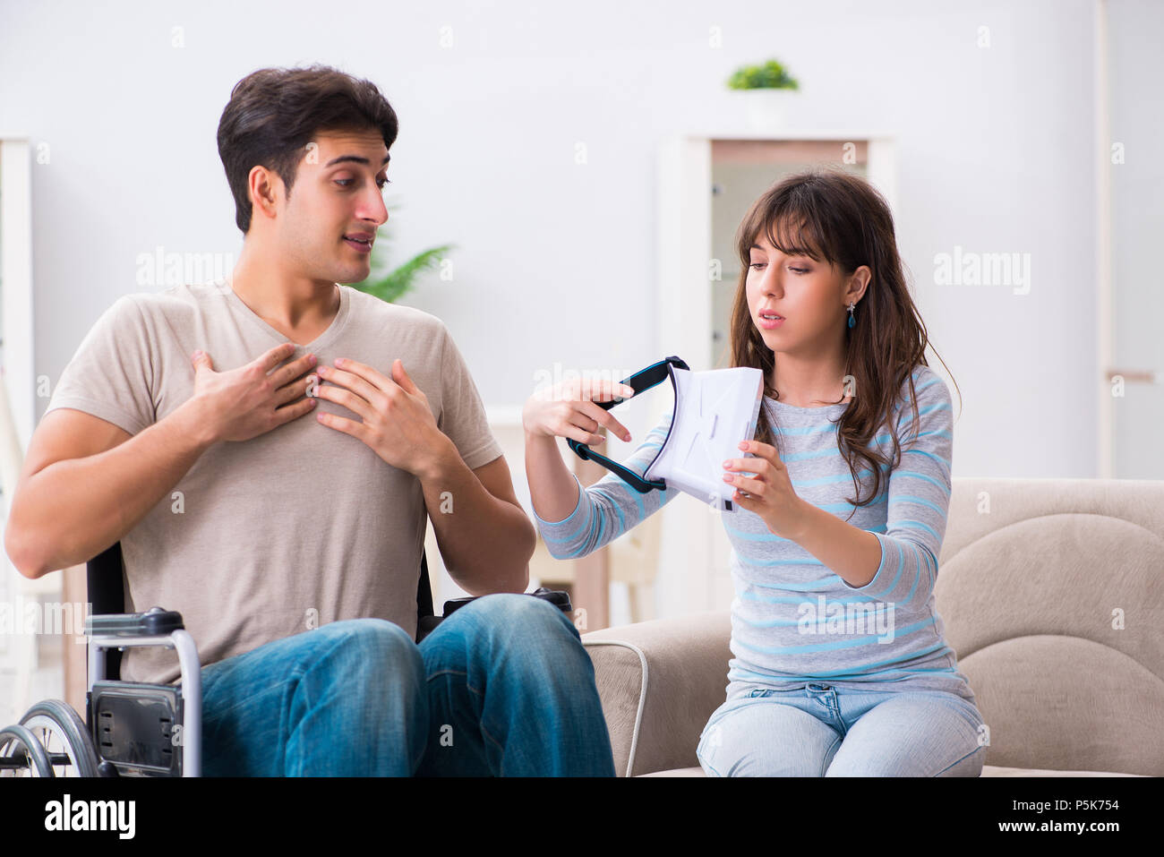 Disabled man with virtual glasses Stock Photo - Alamy