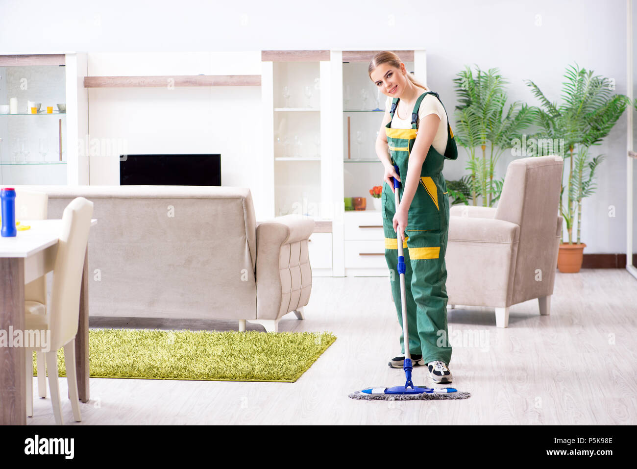 Woman mopping floor with sponge mop hi-res stock photography and images ...