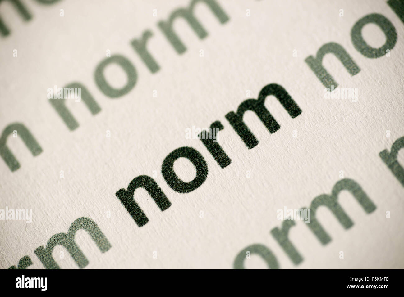 word norm printed on white paper macro Stock Photo - Alamy