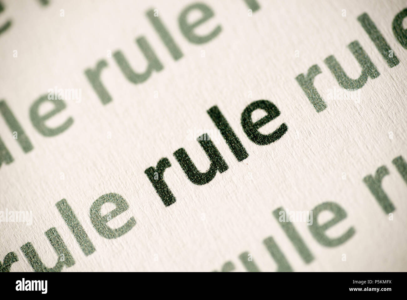 word rule printed on white paper macro Stock Photo - Alamy