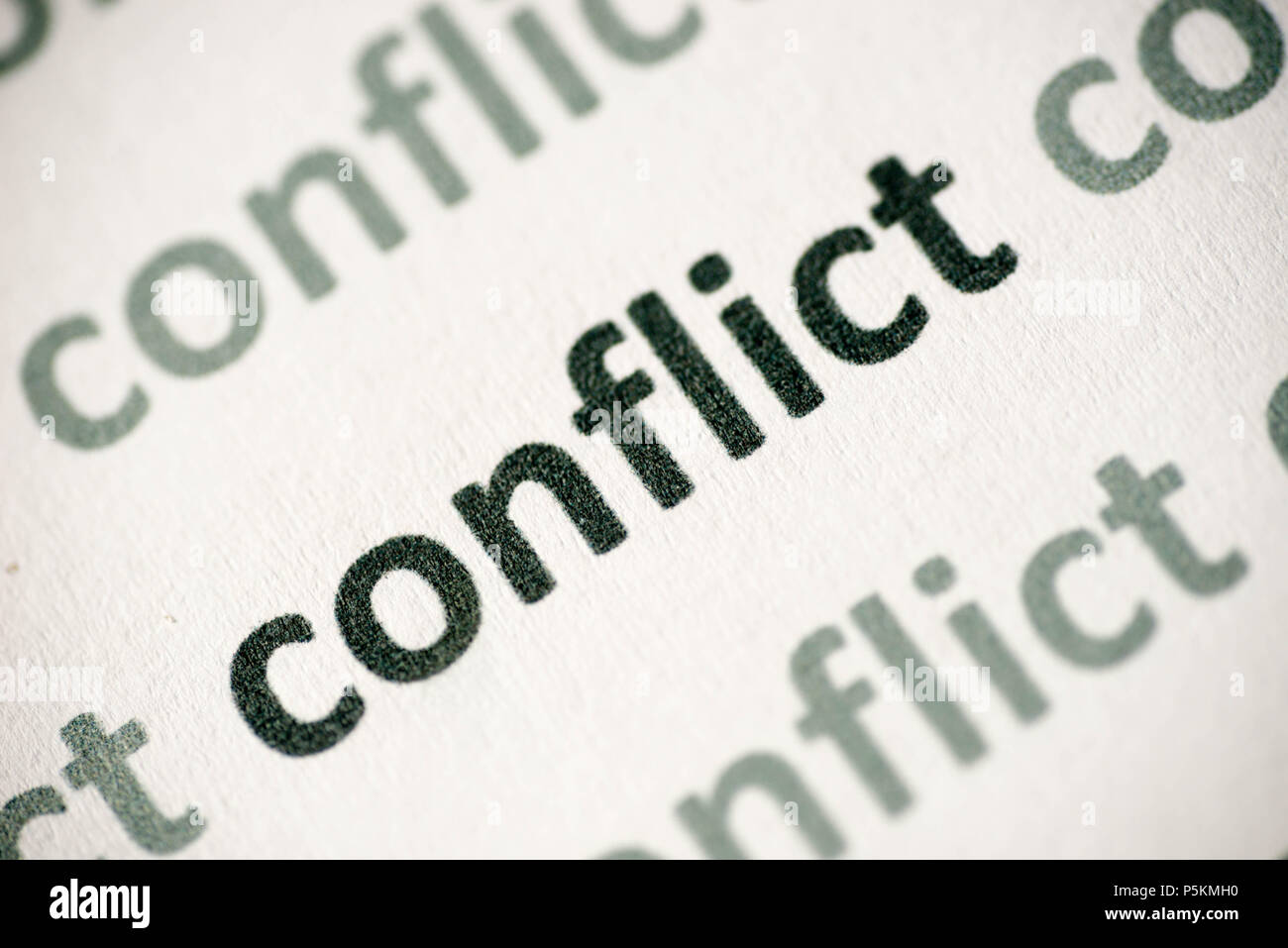 word conflict printed on white paper macro Stock Photo - Alamy