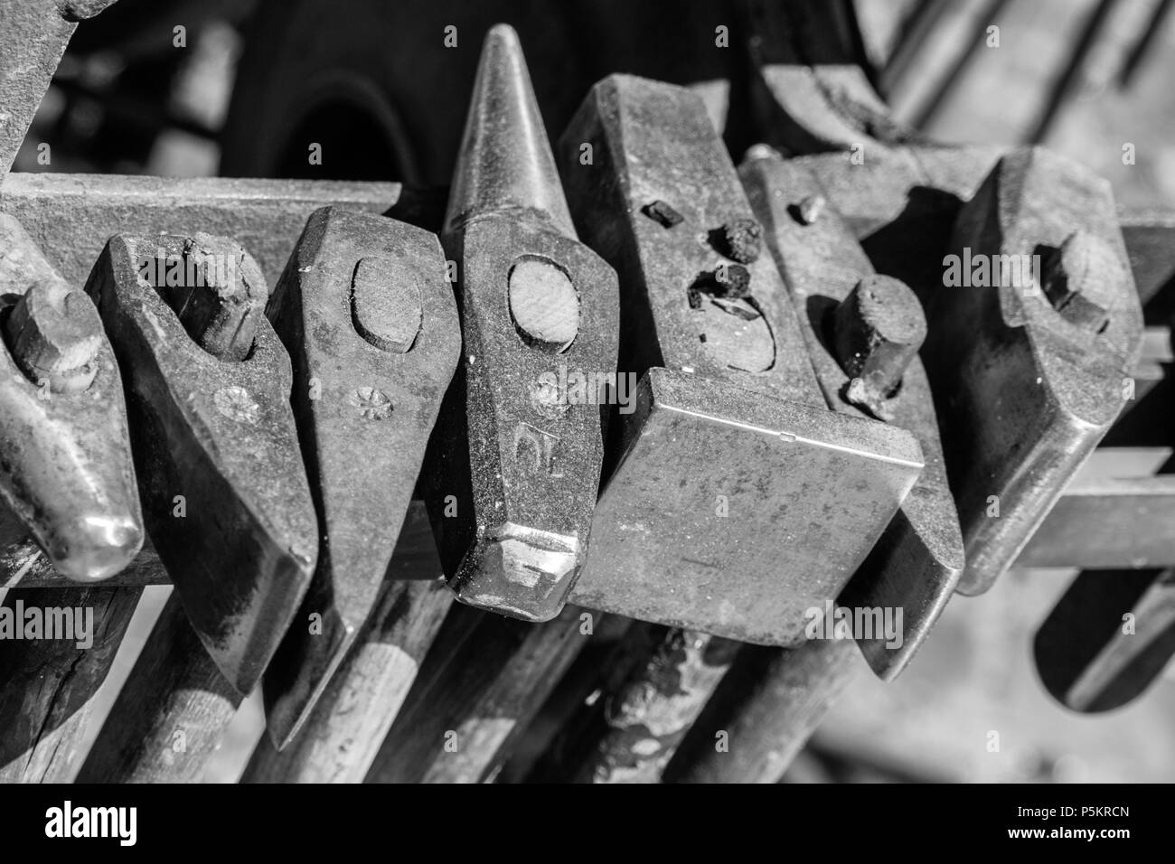 Historical tools of a blacksmith at a medieval market such as hammer ...