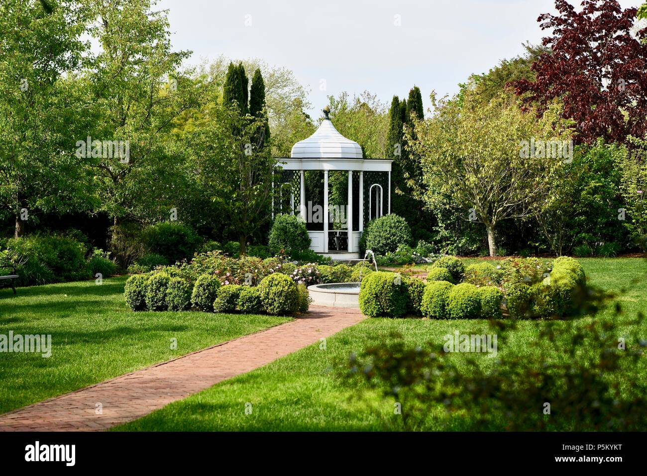 Backyard garden landscaped with a beautiful gazebo Stock Photo - Alamy