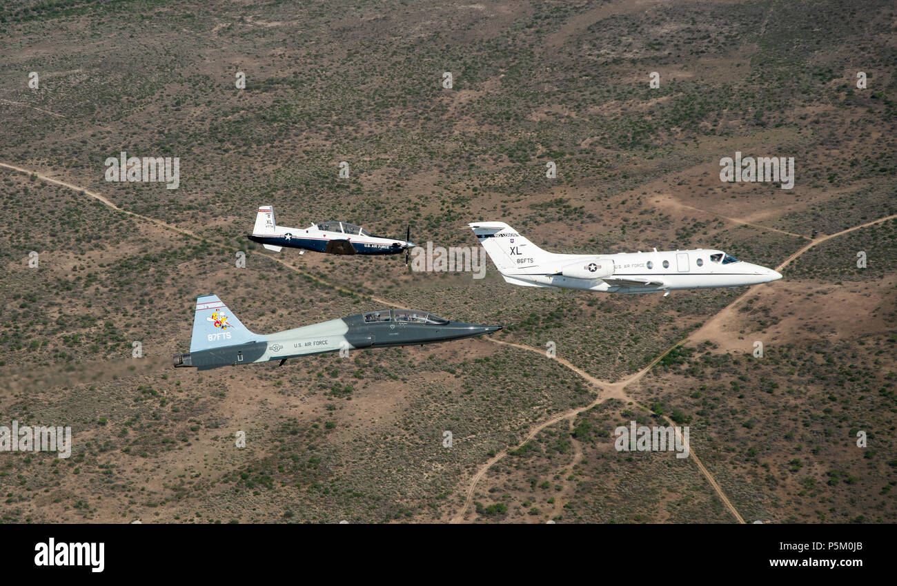 A T-1 Jayhawk, T-6 Texan II, and T-38 Talon fly in a dissimilar ...