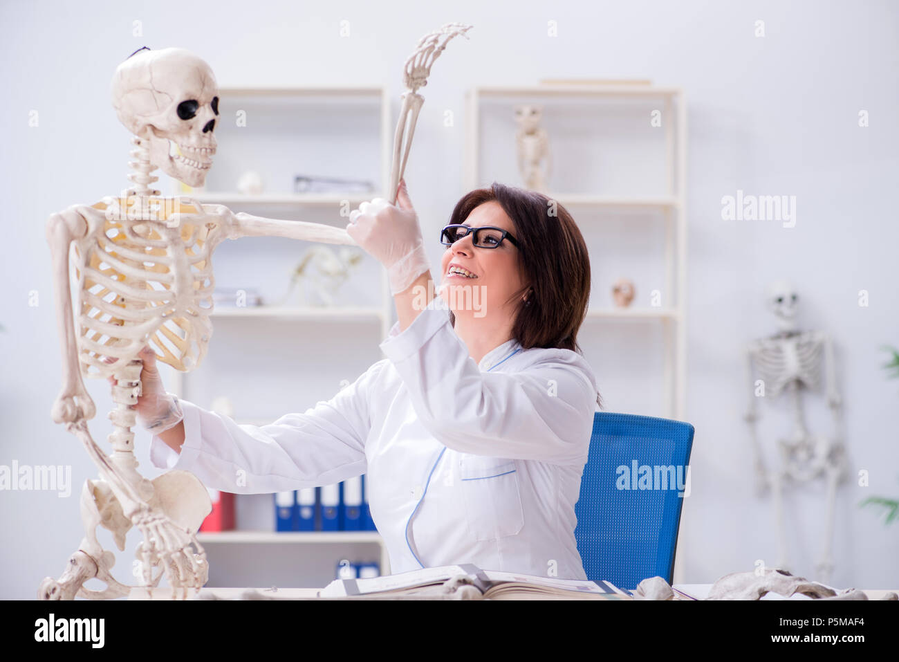 Doctor working in the lab on skeleton Stock Photo - Alamy