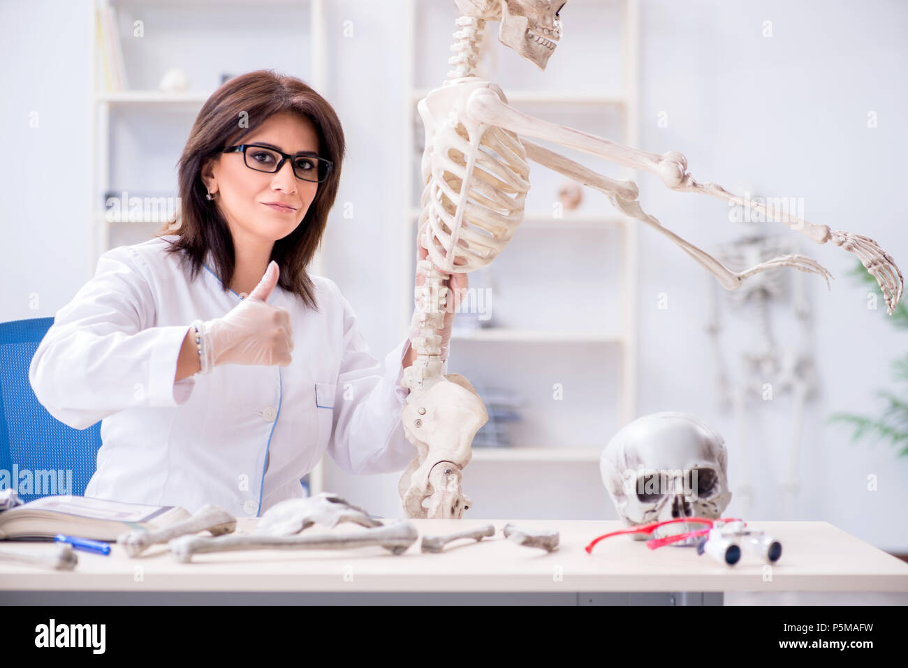 Doctor working in the lab on skeleton Stock Photo - Alamy