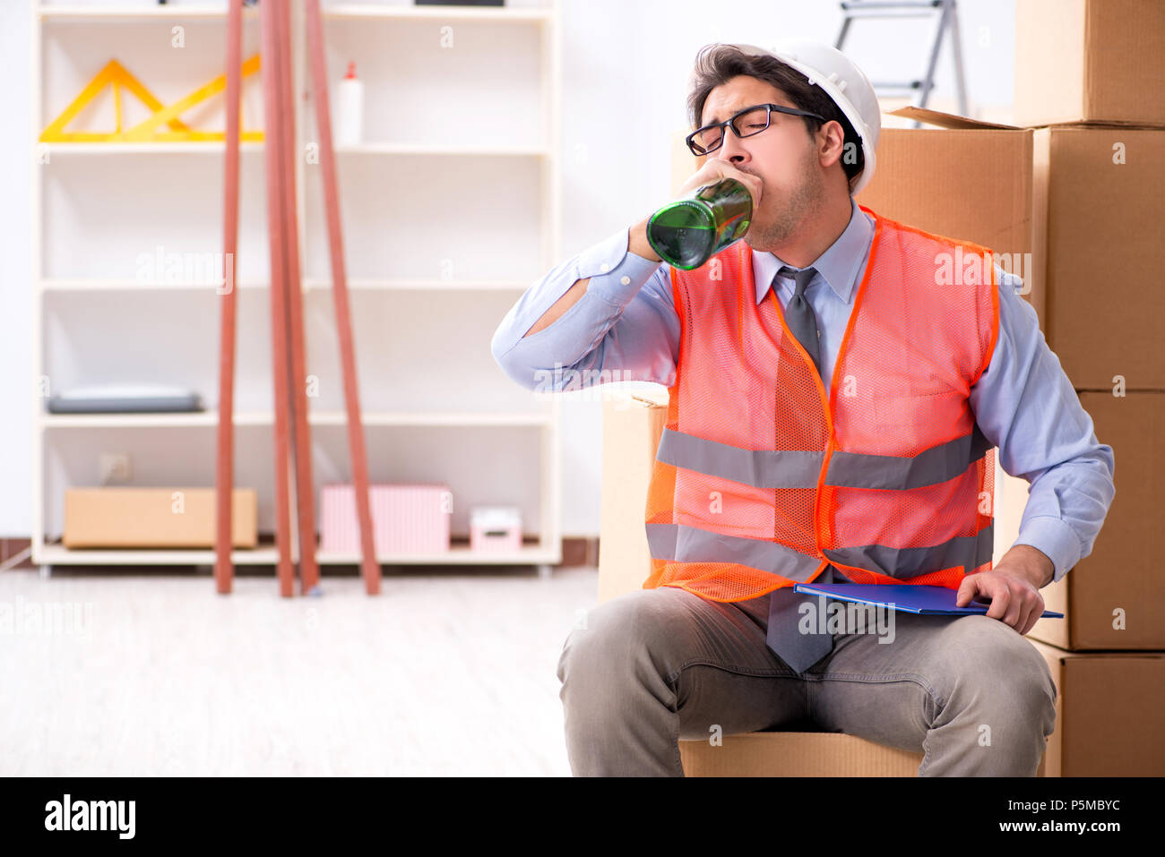 Delivery man drunk at work Stock Photo - Alamy