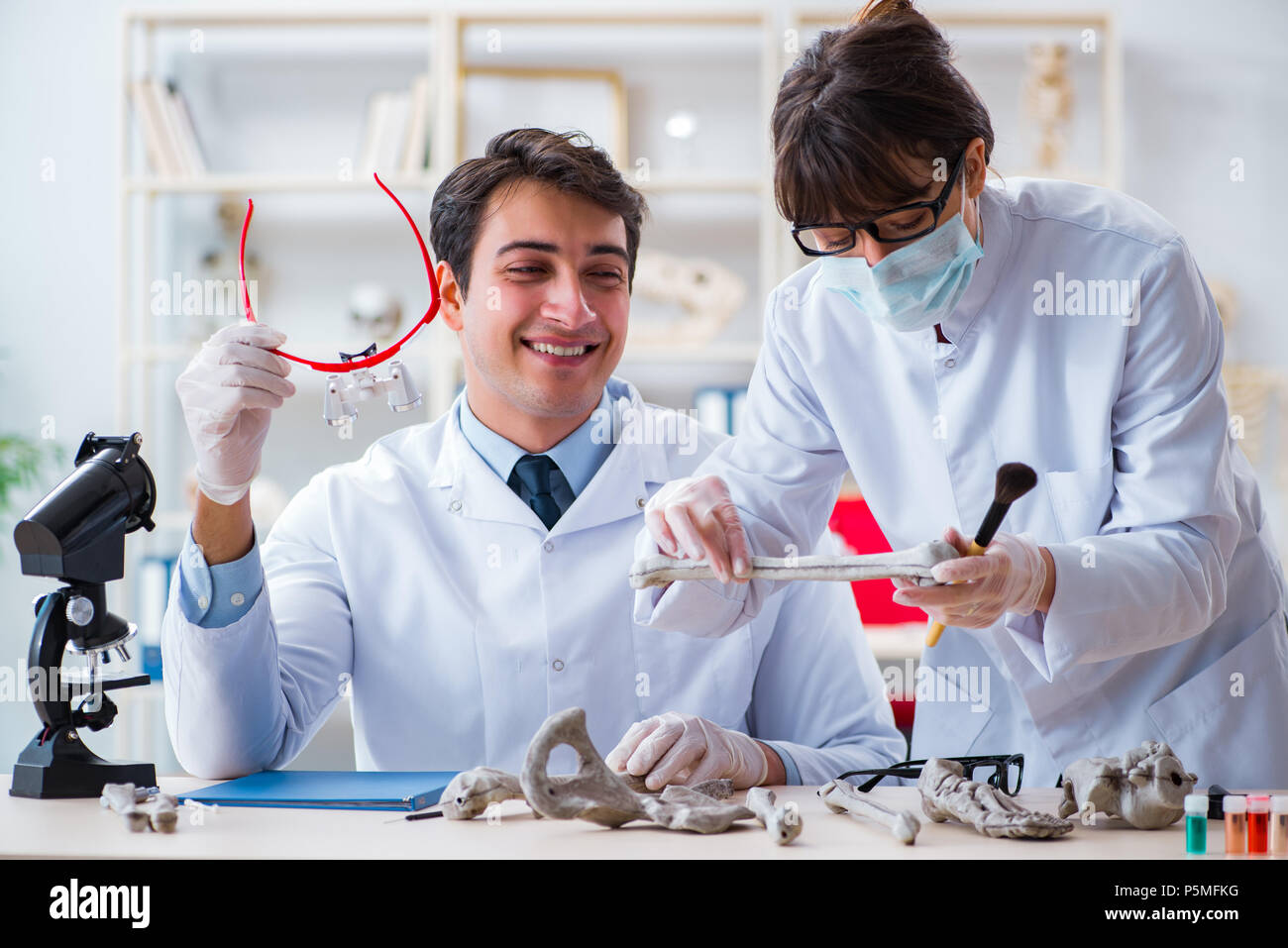 Professor studying human skeleton in lab Stock Photo - Alamy