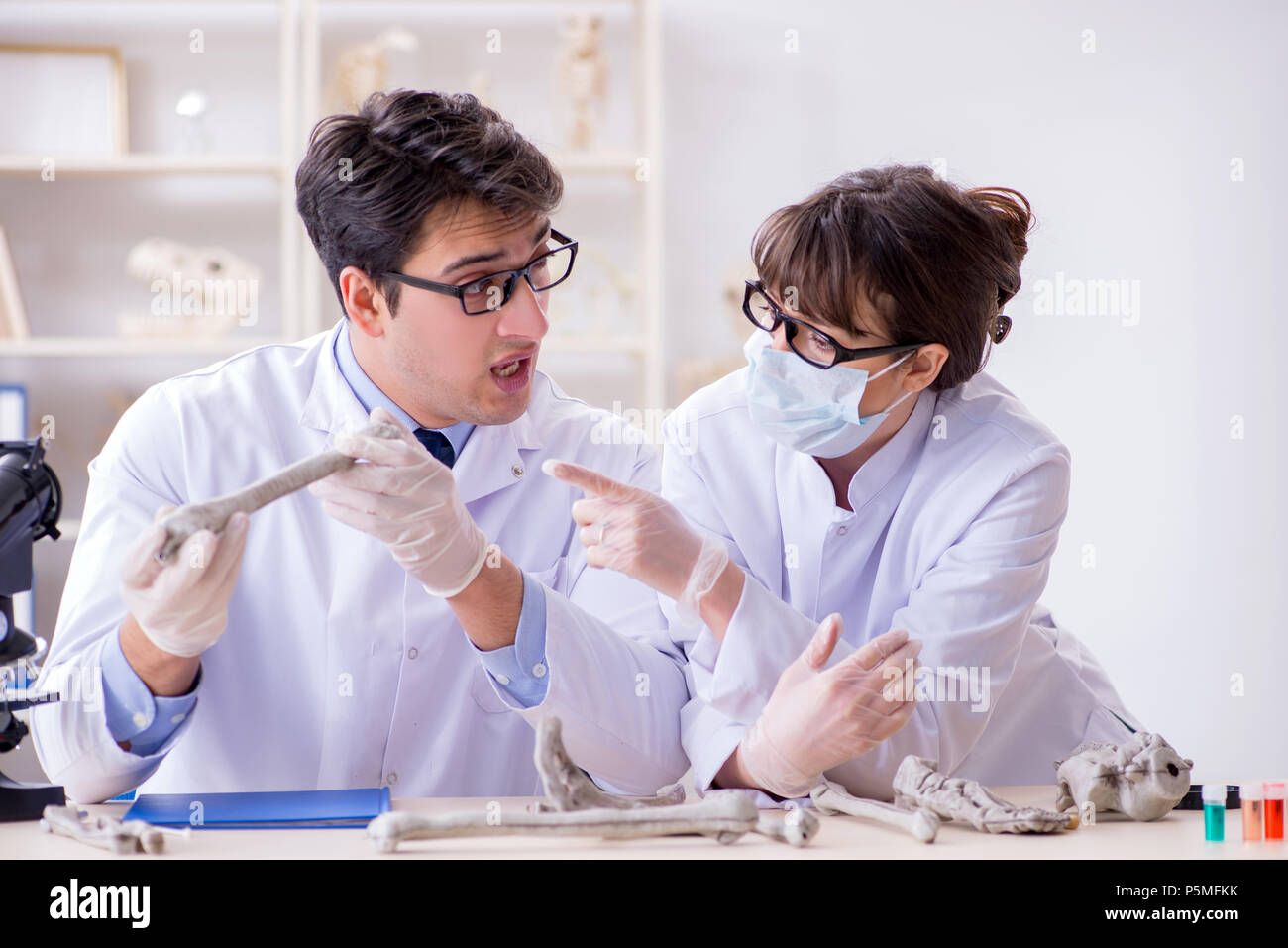 Professor studying human skeleton in lab Stock Photo - Alamy