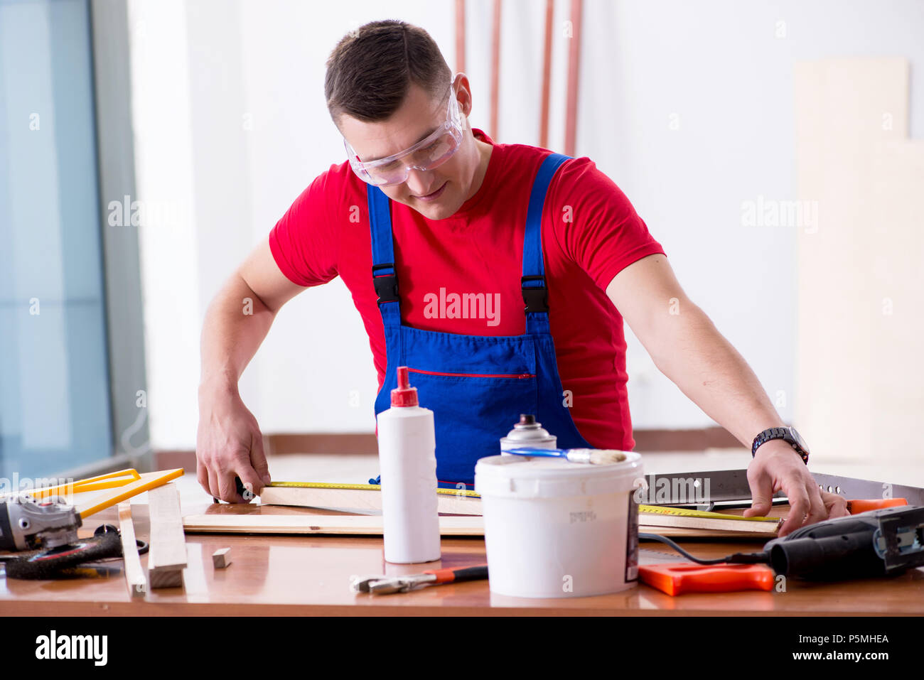 Contractor working in the workshop Stock Photo - Alamy