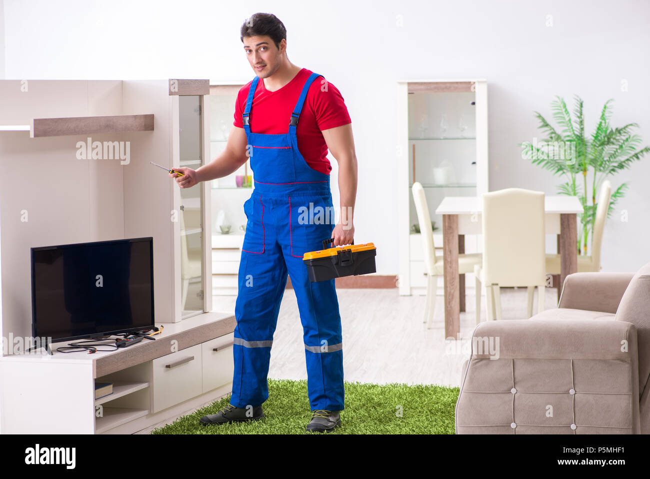 Professional repair engineer repairing broken tv Stock Photo - Alamy
