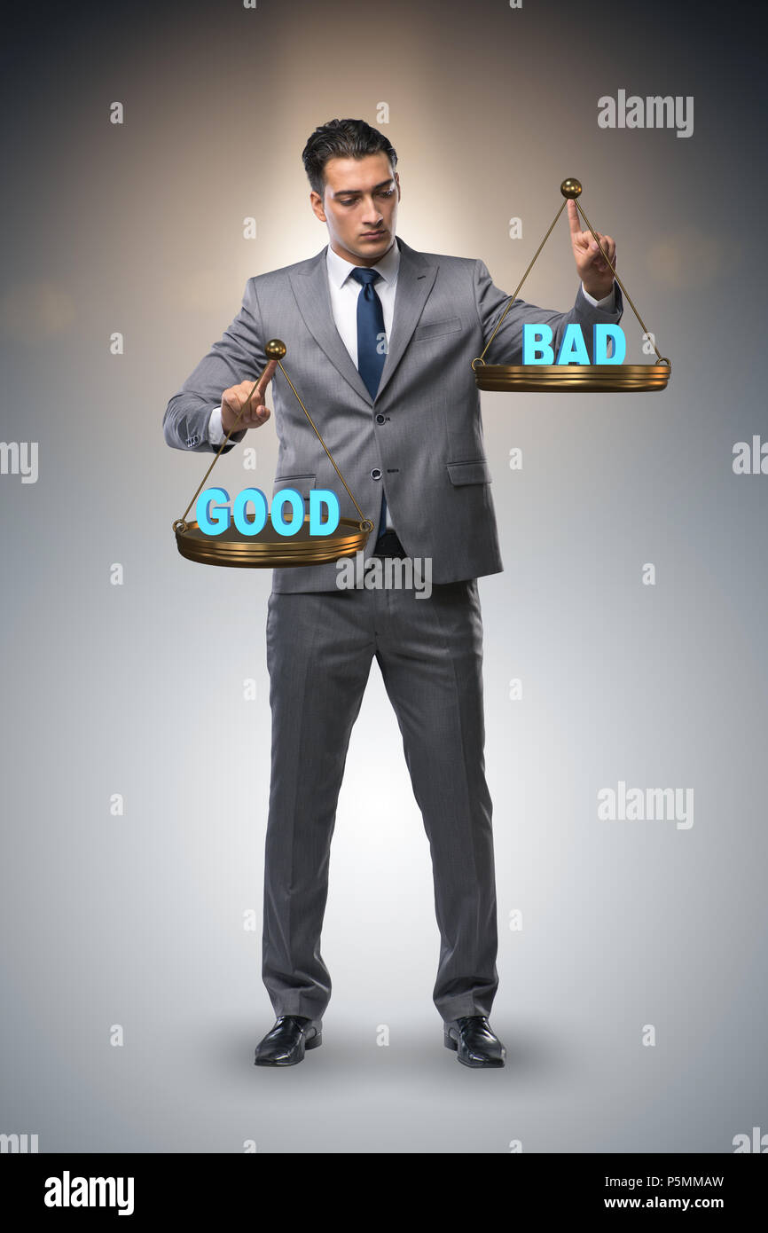 Businessman choosing between good and bad Stock Photo - Alamy