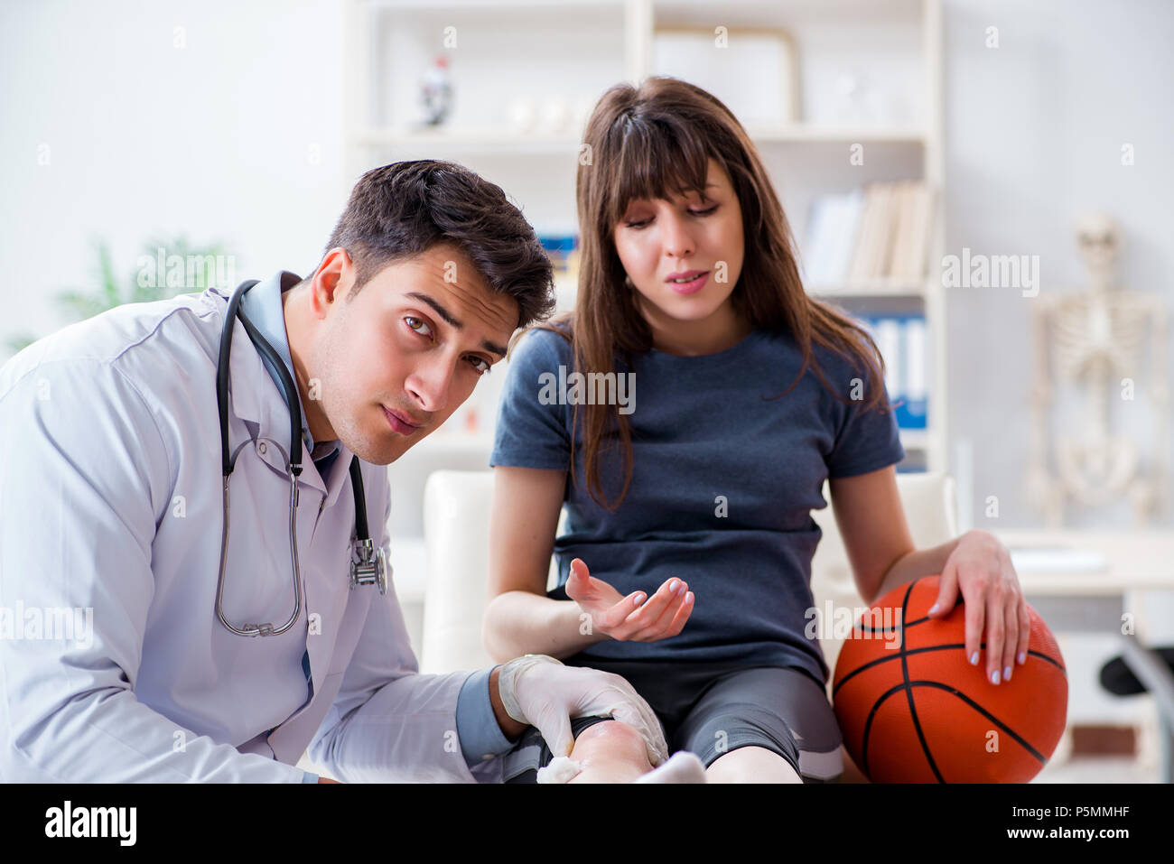 Female basketball player visiting doctor after injury Stock Photo - Alamy