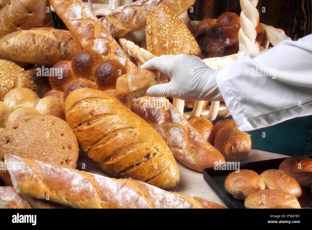 an image of variety of breads and chief Stock Photo - Alamy