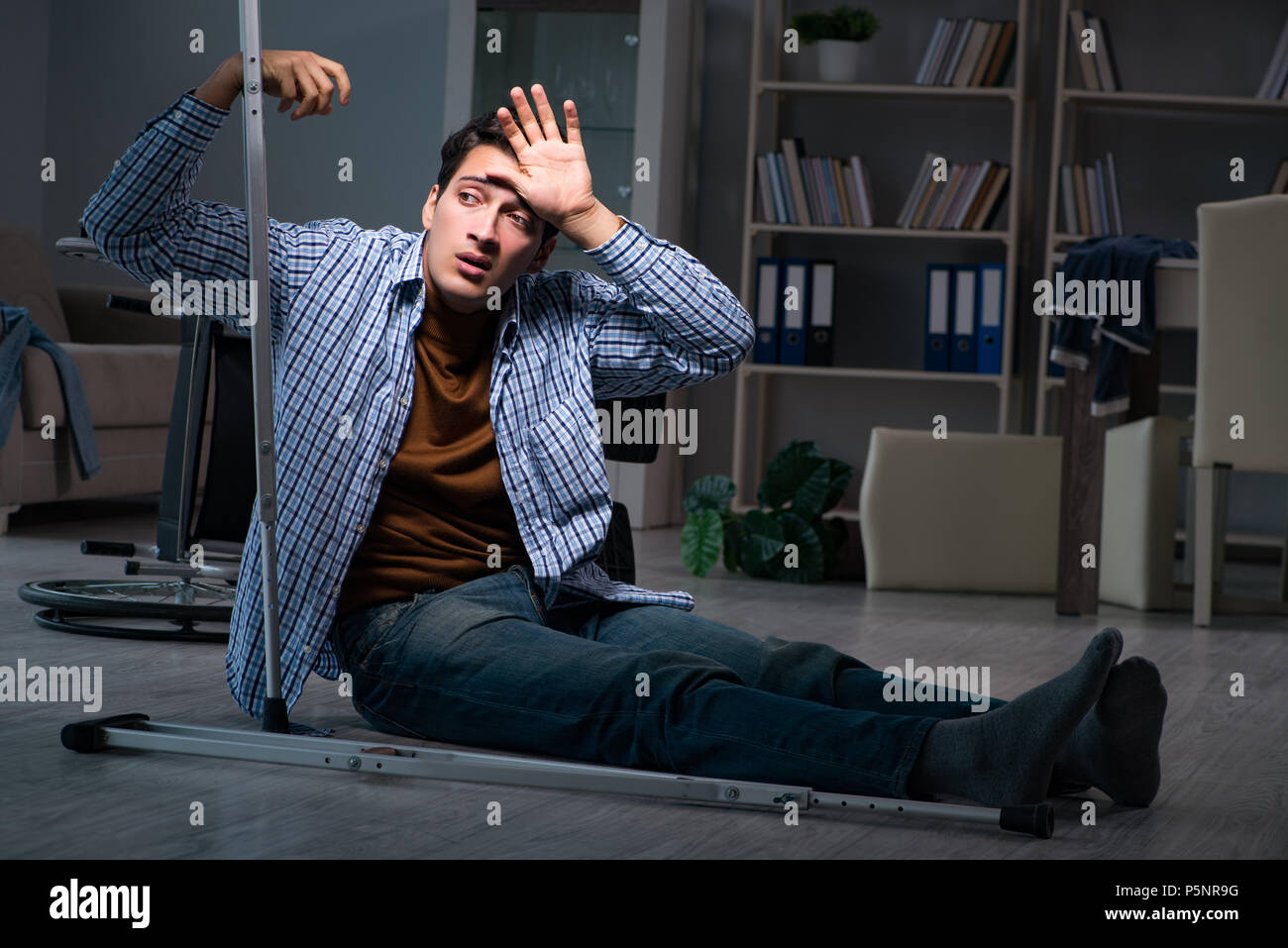 Man falling off chair hi-res stock photography and images - Alamy