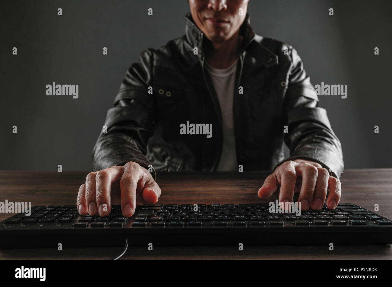 Japanese man working with keyboard Stock Photo - Alamy