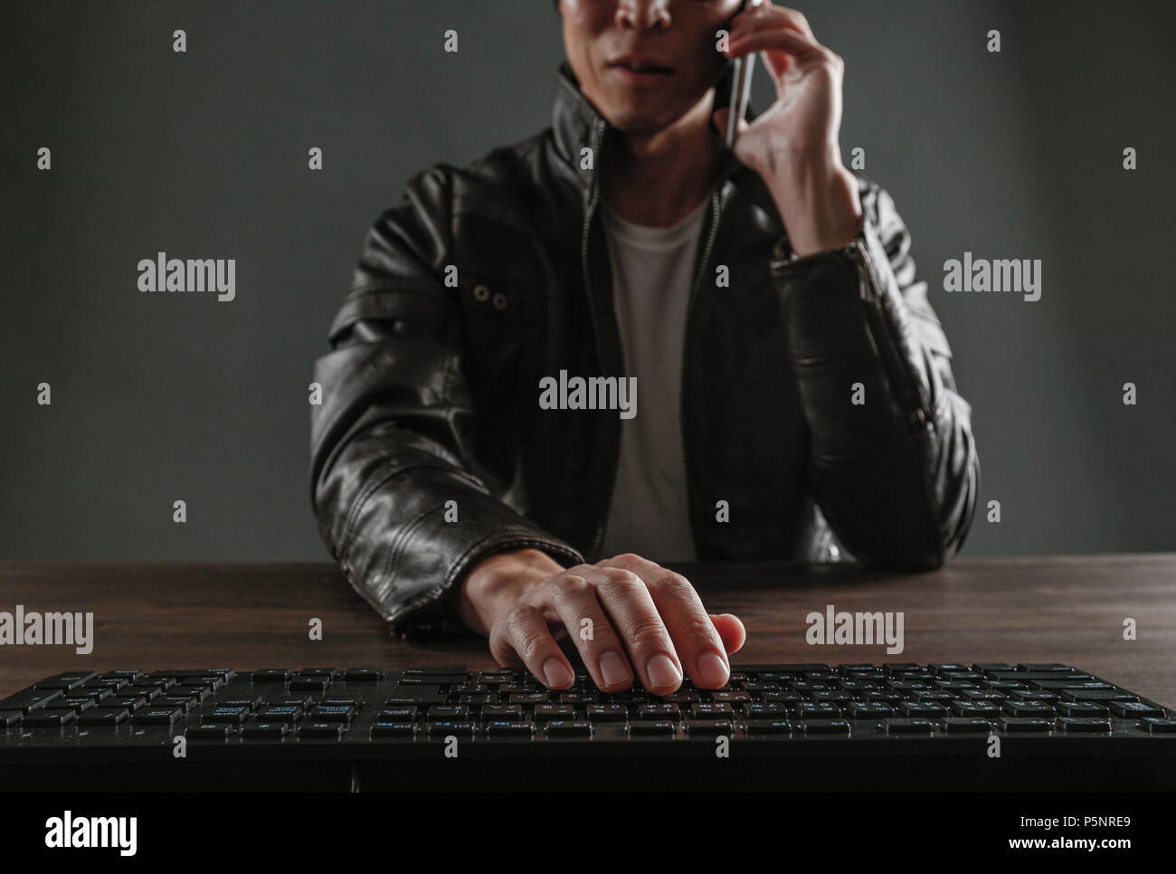 Japanese man working with keyboard Stock Photo - Alamy