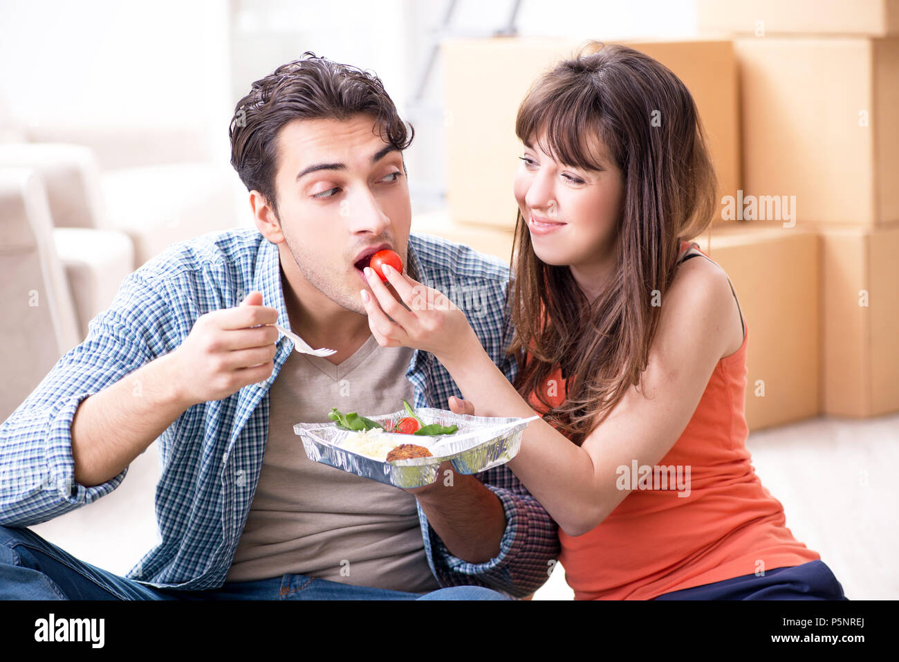 Move apartment eating hi-res stock photography and images - Alamy