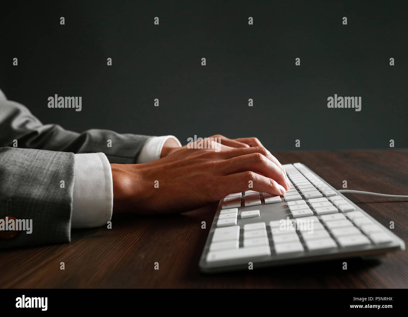 Male hands working on keyboard Stock Photo - Alamy