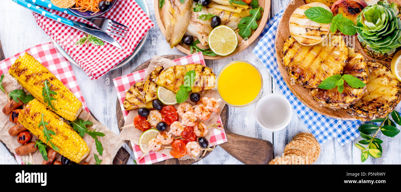 Vegetables, fruits and shrimp on the grill, for a summer lunch. Healthy ...