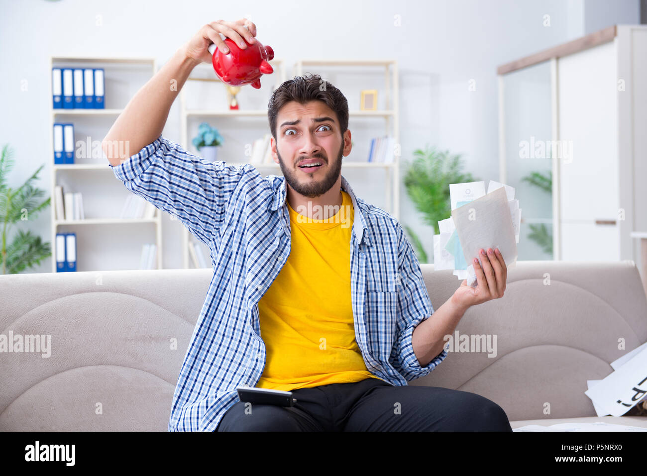 Man angry at bills he needs to pay Stock Photo - Alamy