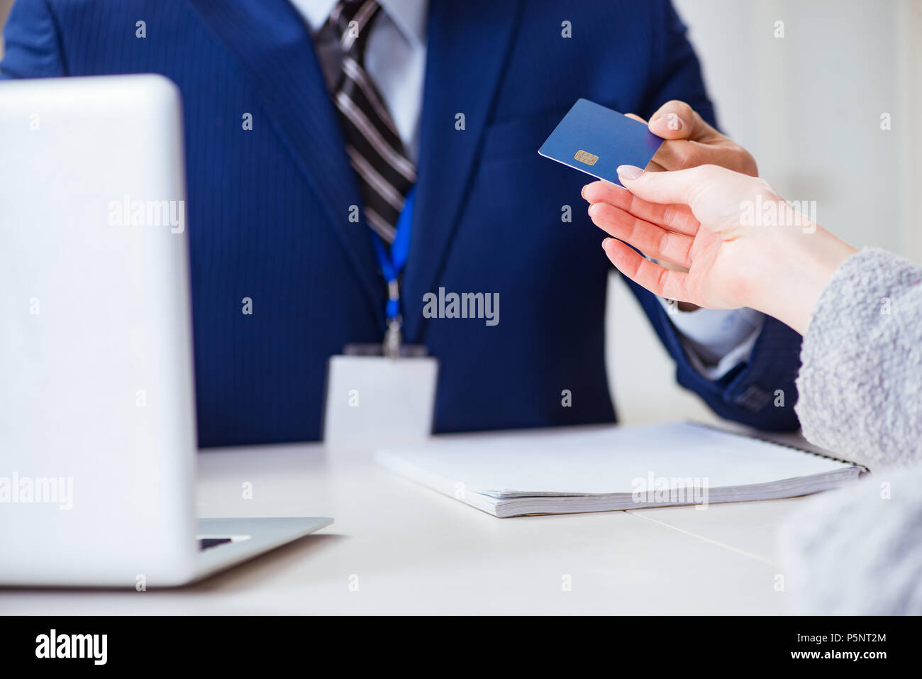 Woman makes payment with credit card Stock Photo - Alamy