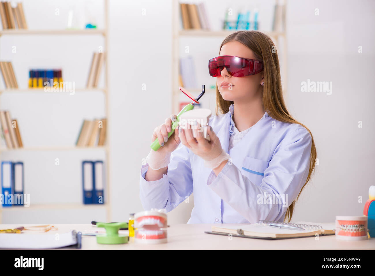 Dentistry student practicing skills in classroom Stock Photo - Alamy