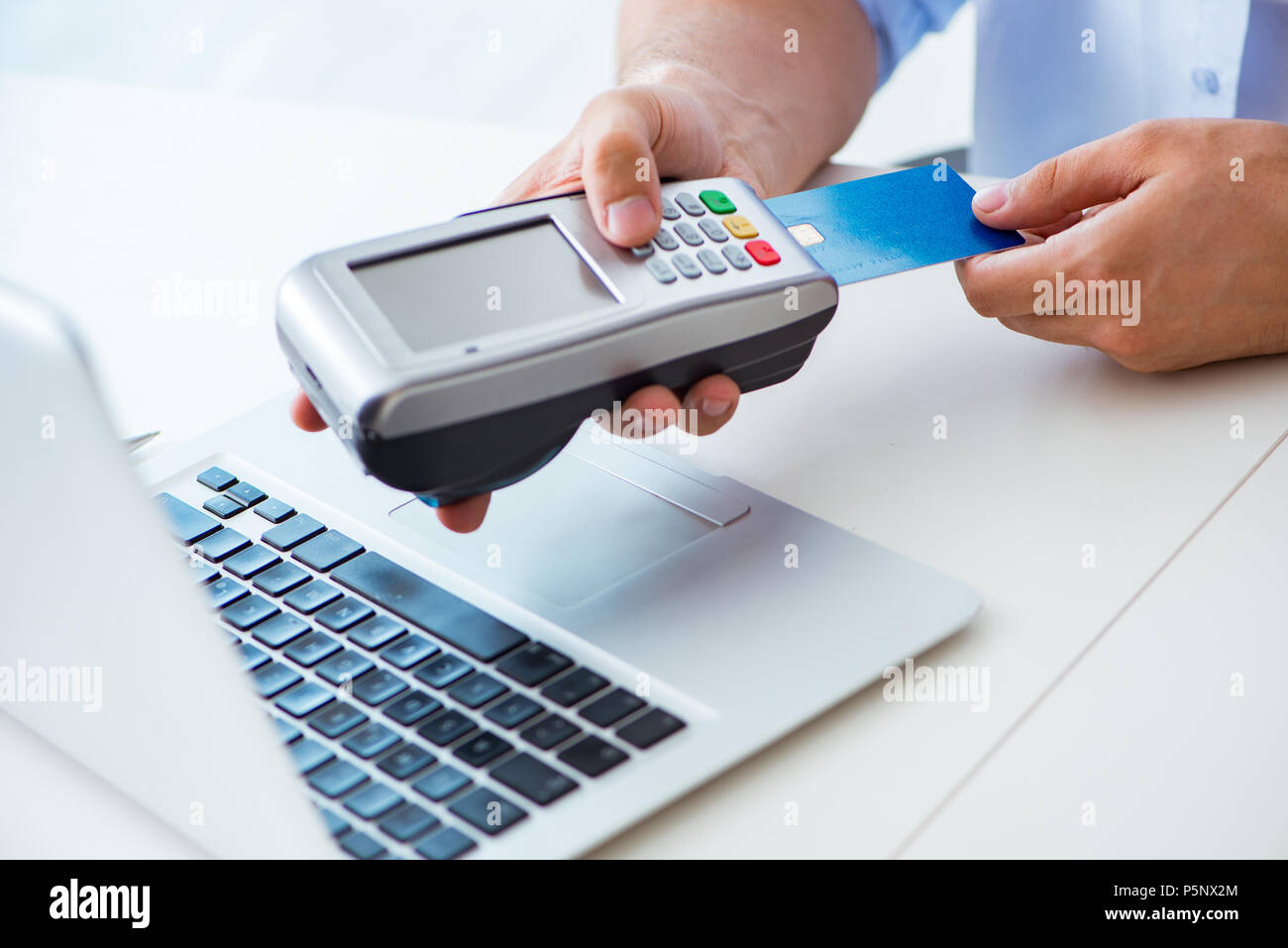Man processing credit card transaction with POS terminal Stock Photo ...