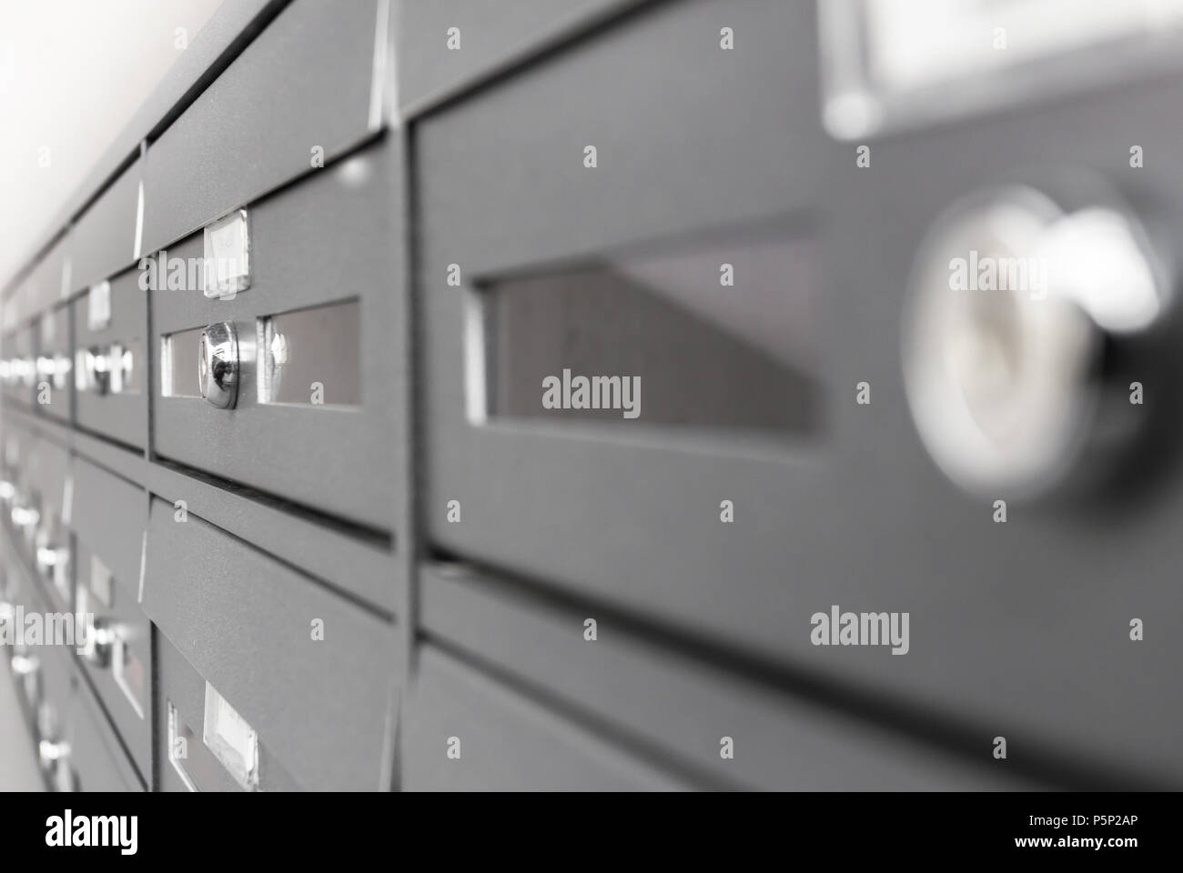 Group of letterbox with lock in condo Stock Photo - Alamy