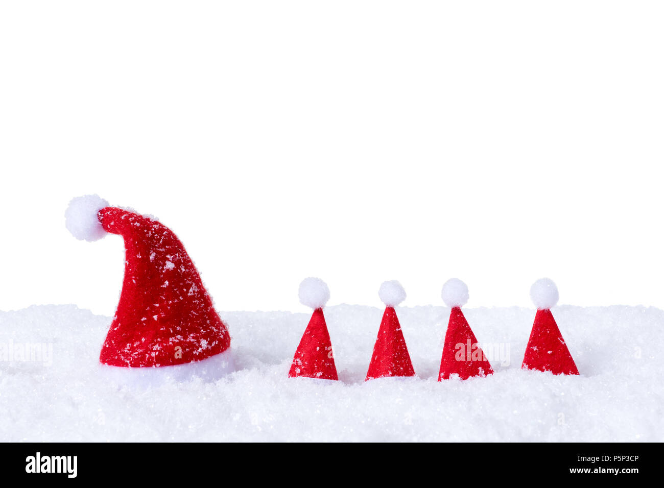 Christmas hats in front of snow isolated on white background Stock ...