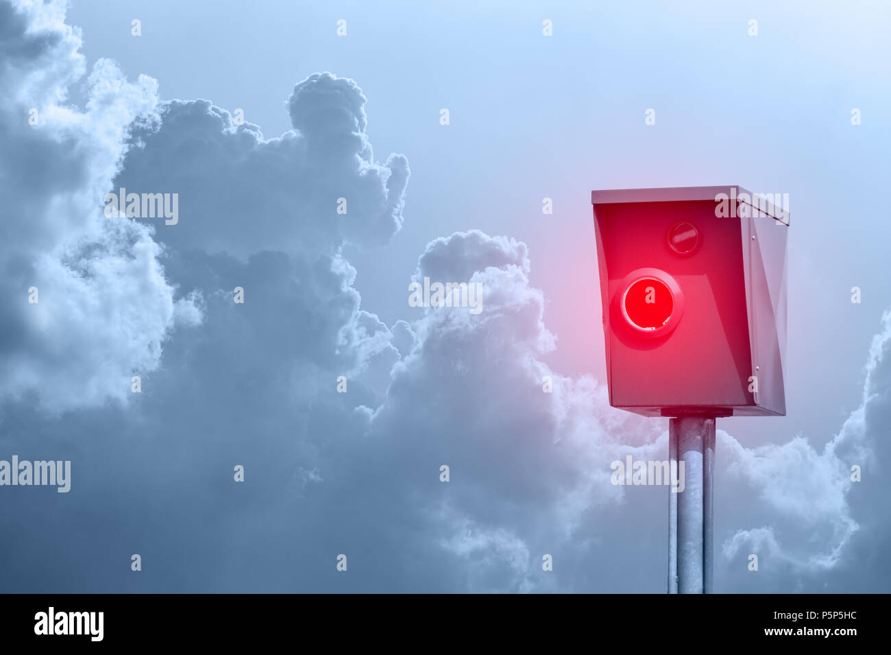 A typical radar trap, speed trap, speed camera in front of cloudy sky ...