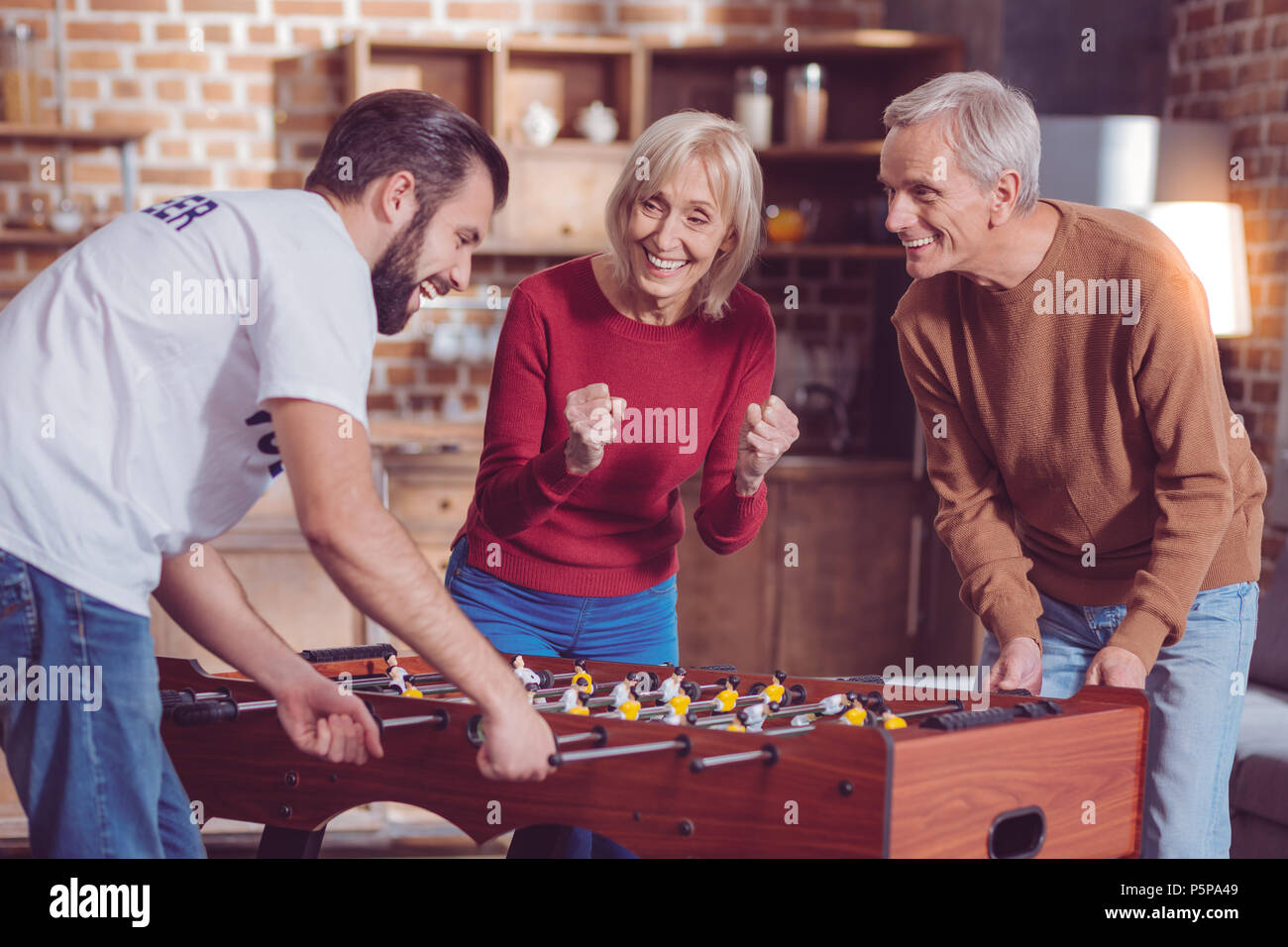 Happy woman cheering her friends Stock Photo - Alamy