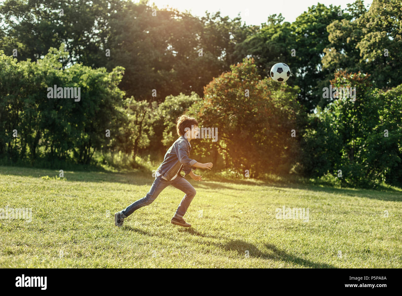 Boy child running outdoors exercise hi-res stock photography and images ...