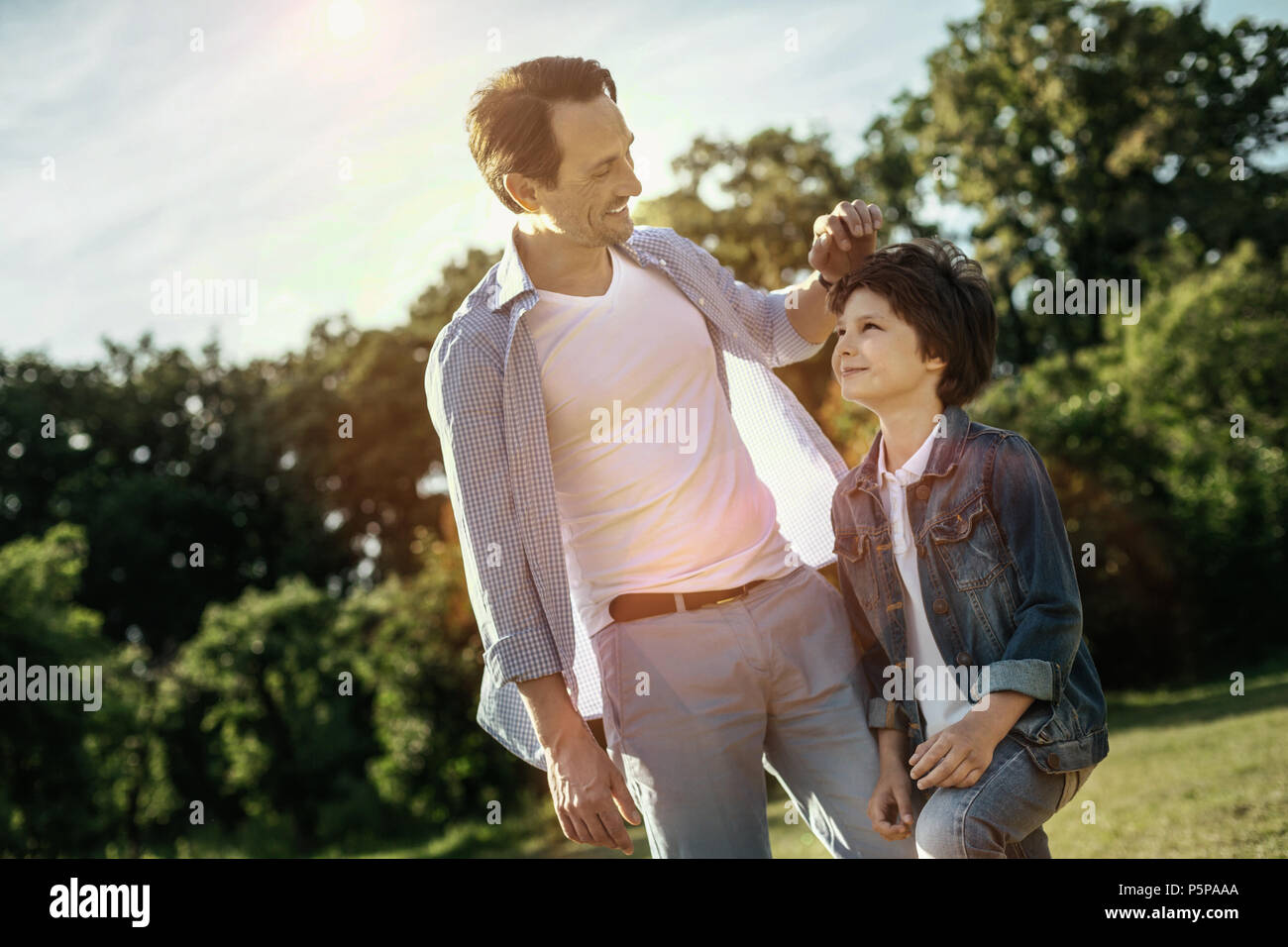 Daddy and son smiling at each other Stock Photo - Alamy
