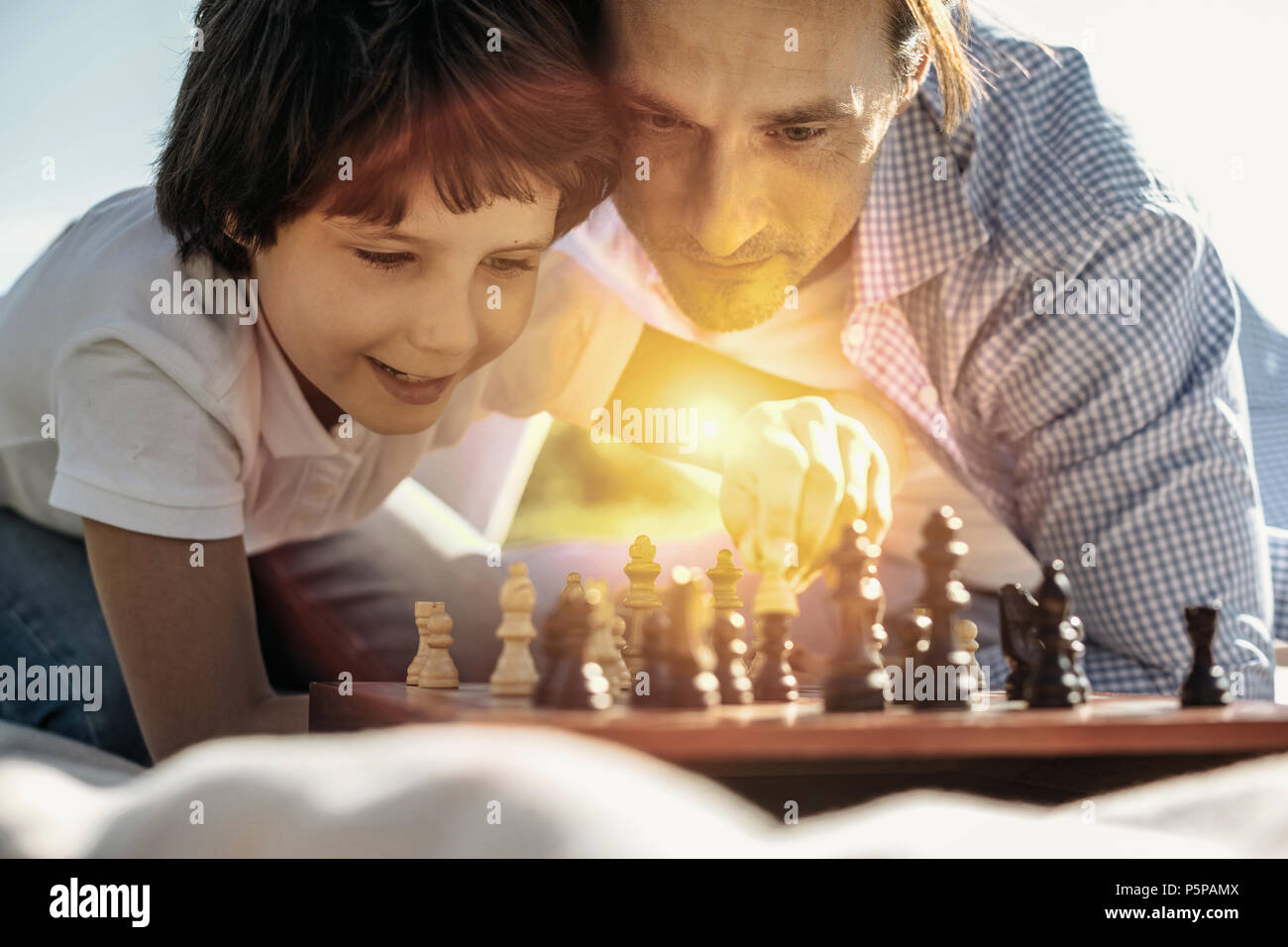 Happy father son chess hi-res stock photography and images - Alamy