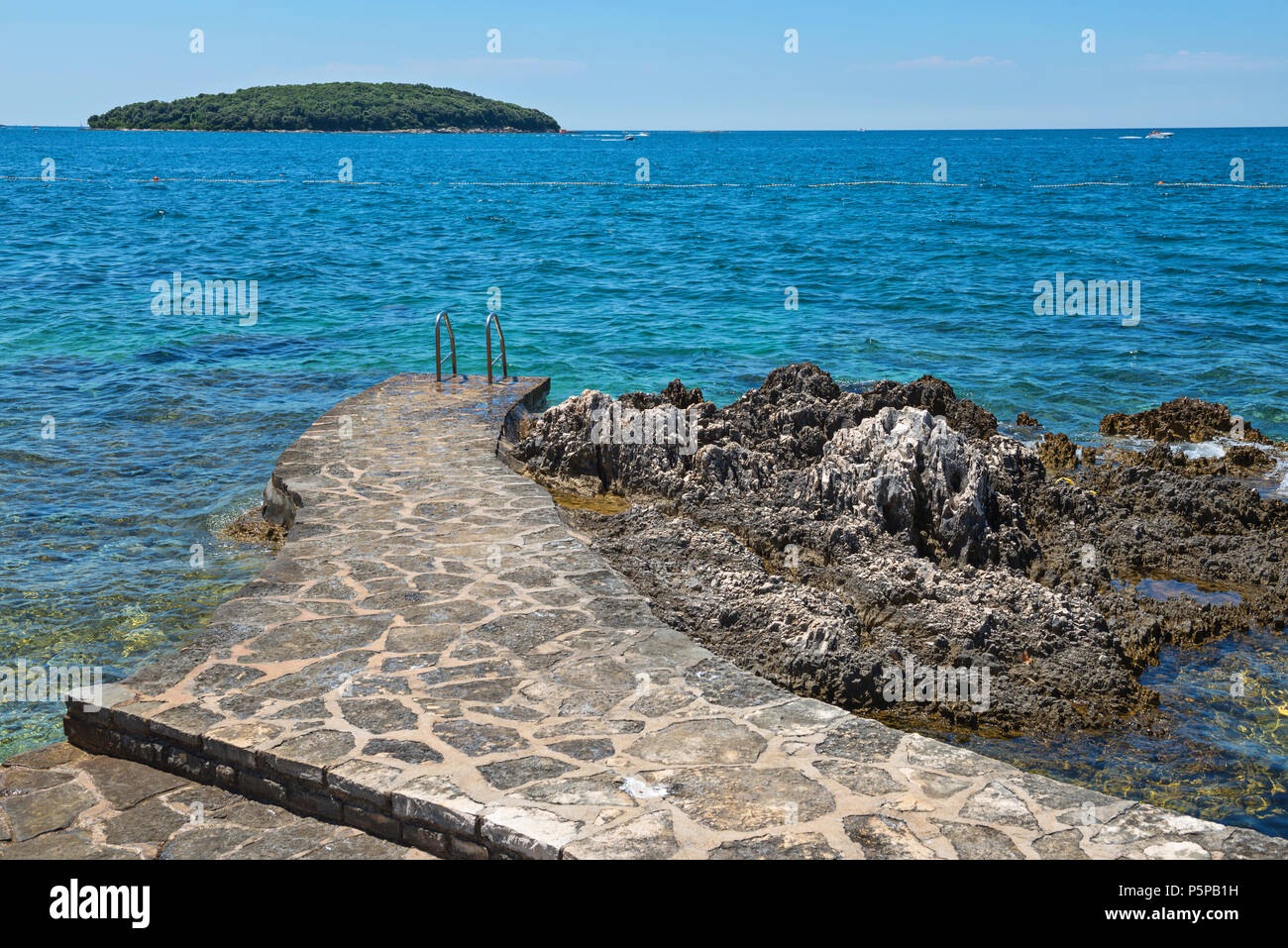 Pathway On The Typical Rocky Beach In Istria Croatian Coast Blue Transperent Sea And Sky Stock 