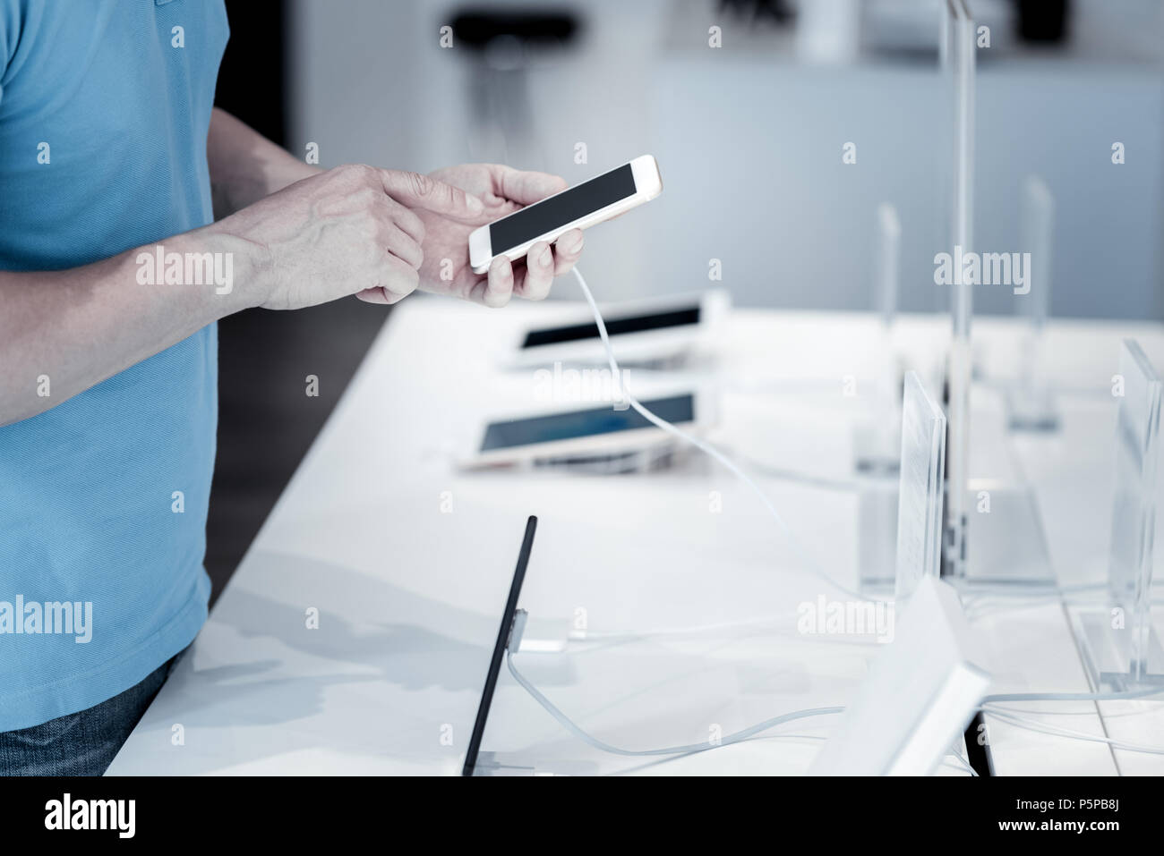 Amazing tiny smartphone in the hands of a customer Stock Photo - Alamy