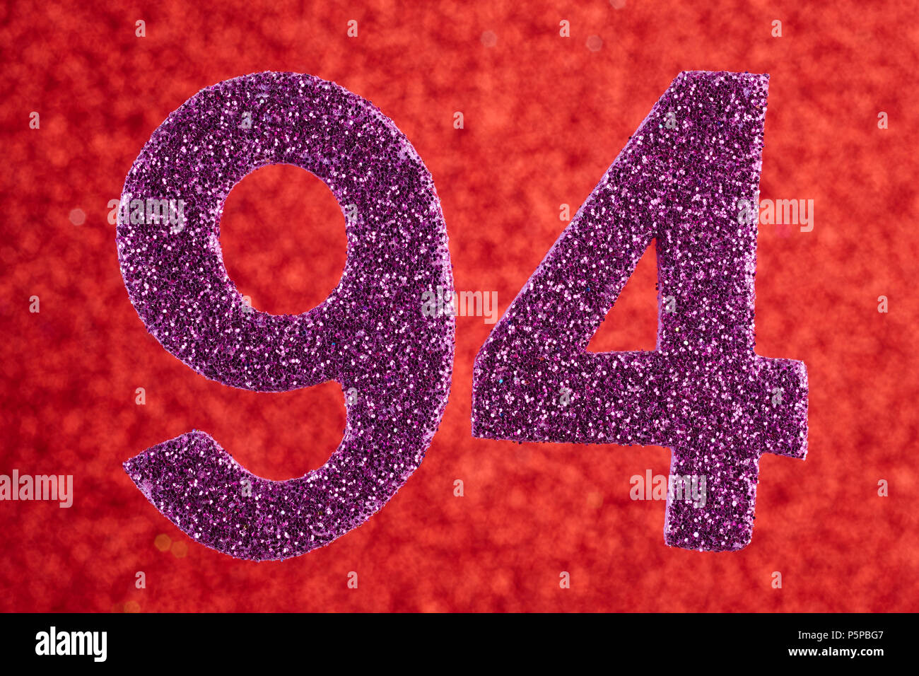 Number ninety-four purple color over a red background. Anniversary ...